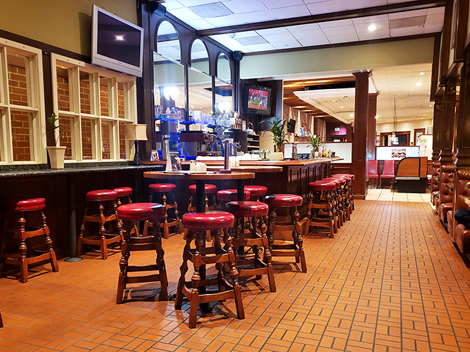 Those red-topped stools aren't just seating; they're front-row tickets to the greatest breakfast show on earth, complete with bottomless coffee.
