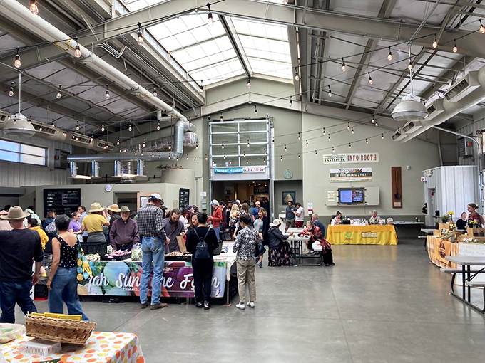 Sunlight streams through skylights illuminating the indoor pavilion, where locals gather to celebrate New Mexico's agricultural bounty year-round, regardless of weather.