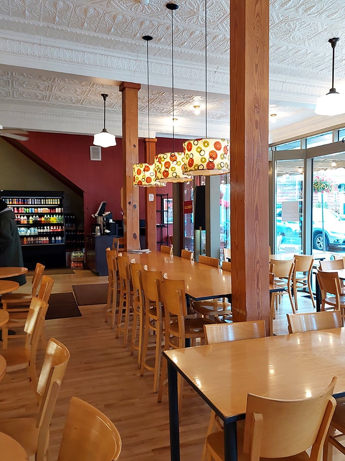 Warm wooden accents, ornate tin ceilings, and those whimsical pendant lights create the perfect backdrop for carb-induced euphoria.