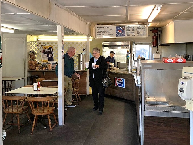 Step inside and you're transported to a simpler time. Wood paneling, straightforward service, and the promise of smoky delights just steps away.