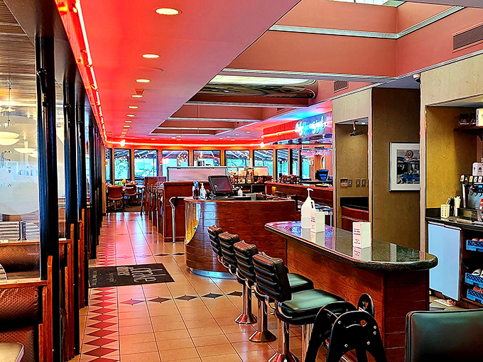 Red ceiling trim meets classic counter seating&mdash;the architectural equivalent of a warm hug. Drake Diner's interior whispers, "Stay awhile."