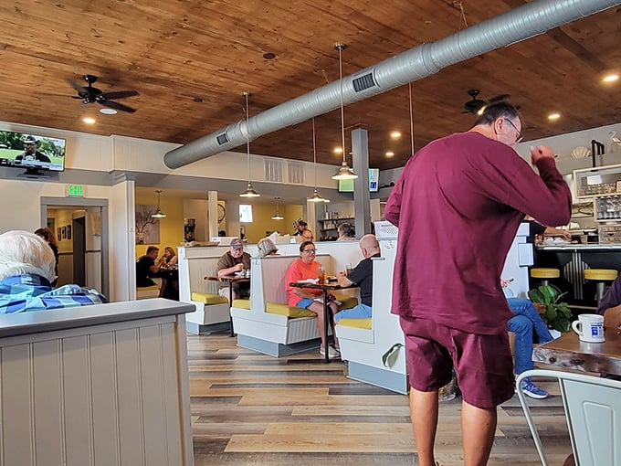 Wooden ceilings, exposed ductwork, and comfortable booths&mdash;the universal language of "you're about to eat really well."