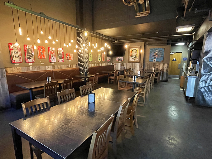 Warm lighting, wooden tables, and local art create the perfect backdrop for serious eating. Comfort meets cool in this rustic-industrial dining room.