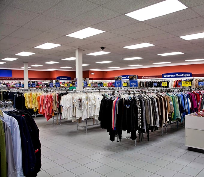 Welcome to the promised land of pre-loved fashion! Organized racks stretch as far as the eye can see, like a department store where everything comes with a backstory.