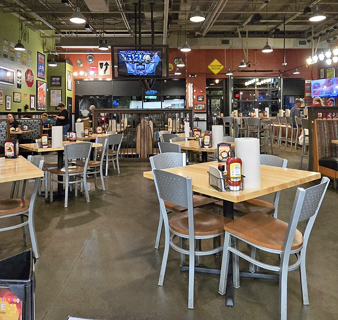 Industrial-chic meets comfort at Bad Daddy's interior. The exposed ceiling and colorful walls create the perfect backdrop for the impending food coma.