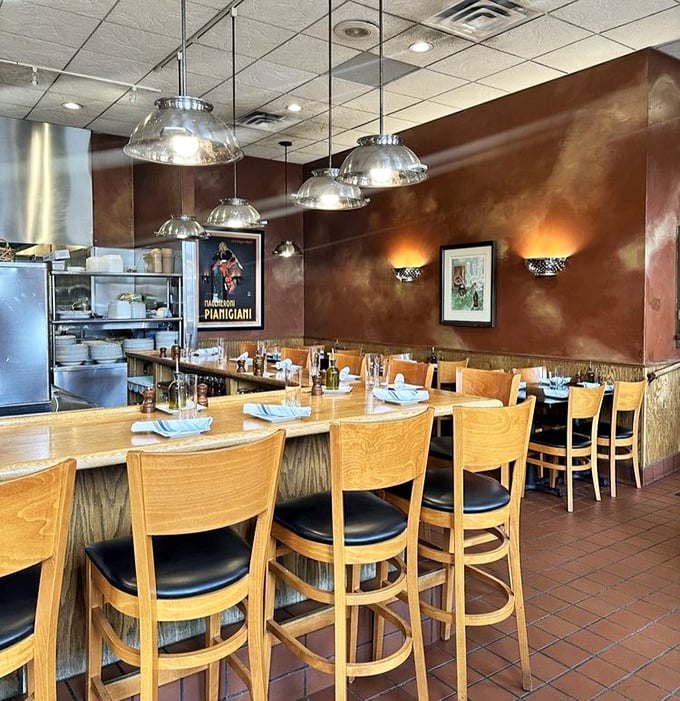 Warm terra-cotta walls and wooden tables create that "Nonna's kitchen" vibe, minus the cheek-pinching. The open kitchen lets you witness pasta magic in real-time.