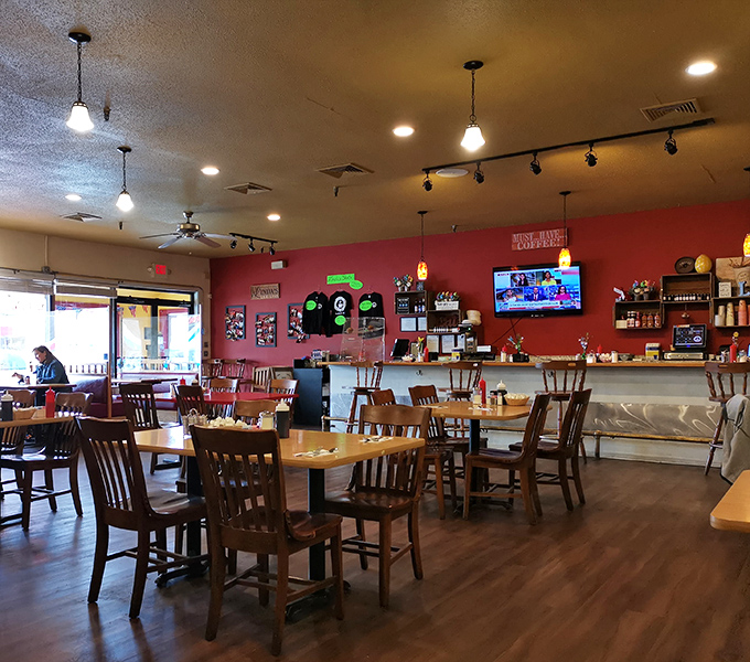 Inside Linda's, the warm red walls and wooden chairs create that perfect "come as you are" atmosphere where calories don't count and coffee flows freely.