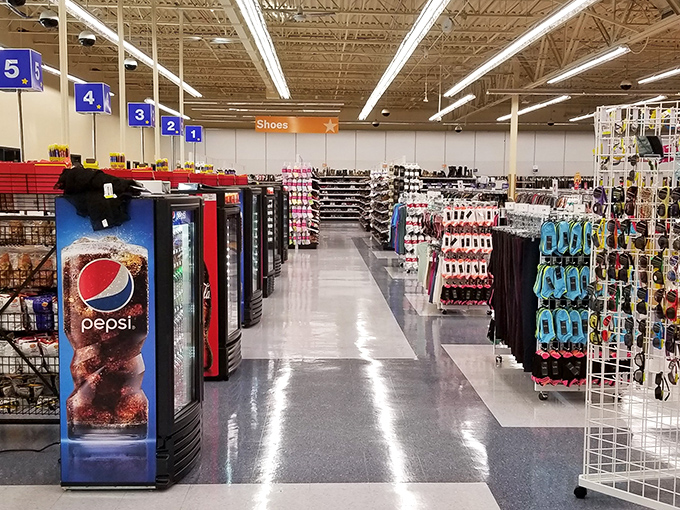 Bright aisles stretch toward shopping infinity, where refrigerated Pepsi stands guard over a kingdom of secondhand treasures.