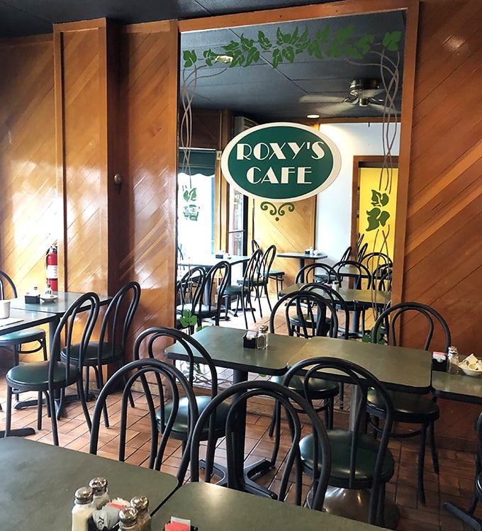 Wooden paneling and classic cafe chairs create that "everybody knows your name" vibe. The interior feels like a warm hug from your favorite aunt who always feeds you too much.