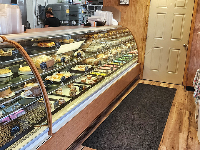 Treasure awaits behind curved glass. Each shelf tells a different delicious story, with characters ranging from flaky to frosted.