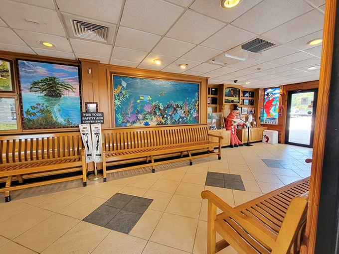 The waiting area's wooden benches and oceanic murals set the stage for the no-frills seafood feast to come.