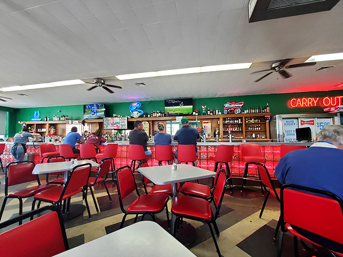 Red chairs, green walls, and neon signs create the perfect backdrop for burger bliss. This isn't manufactured nostalgia—it's the real deal.