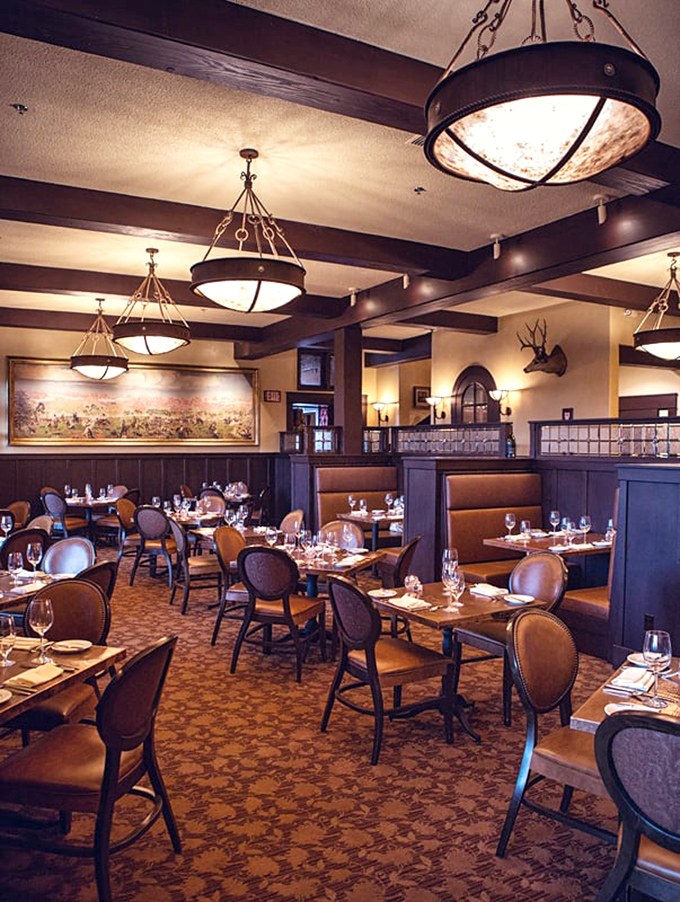 Warm lighting, leather booths, and Western artwork create the perfect atmosphere for serious meat appreciation. Dining room elegance without pretension.