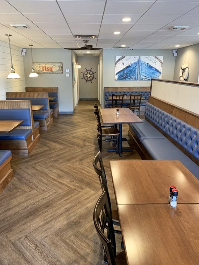 Nautical done right&mdash;ship wheels, blue booths, and herringbone floors create a cozy maritime haven where seafood dreams come true. The captain of this ship clearly knows their design.