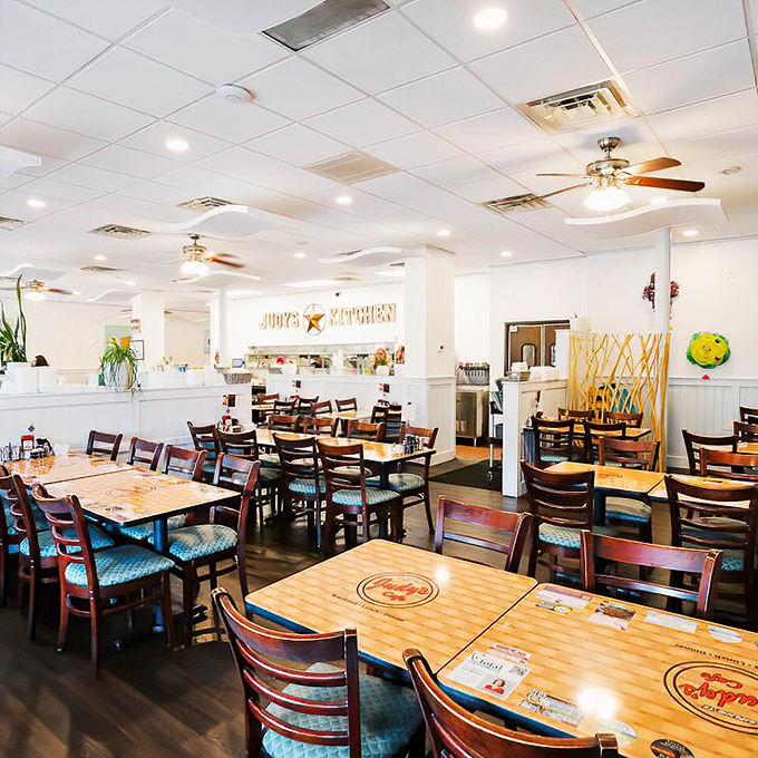 Clean lines, warm wood, and comfortable seating create that perfect "everybody knows your name" atmosphere where conversations flow as freely as the coffee.