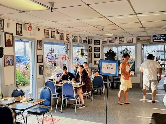 Inside, nautical nostalgia meets practical dining. The walls tell stories of Ventura's fishing heritage while hungry patrons eagerly await their oceanic treasures.