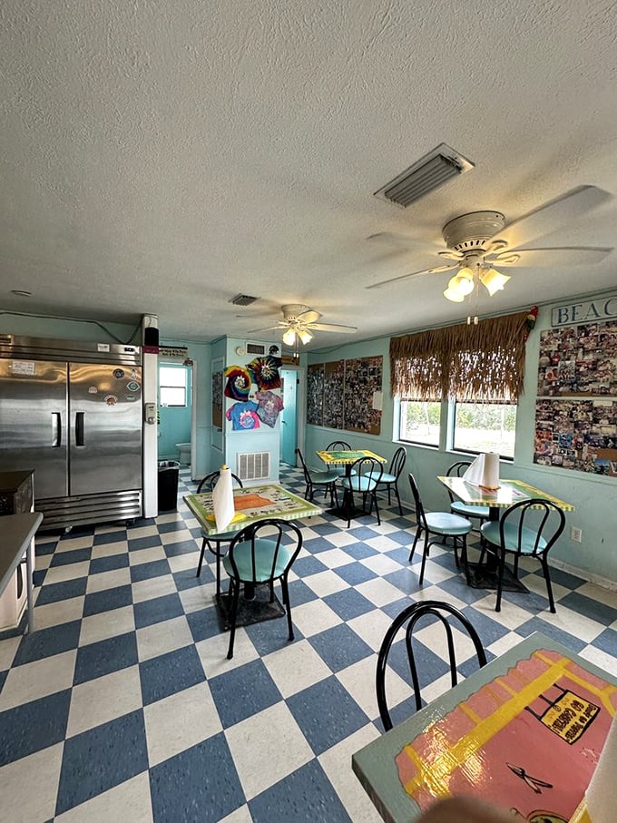 The classic black-and-white checkered floor says "timeless," while the aqua walls whisper "you're on vacation now."