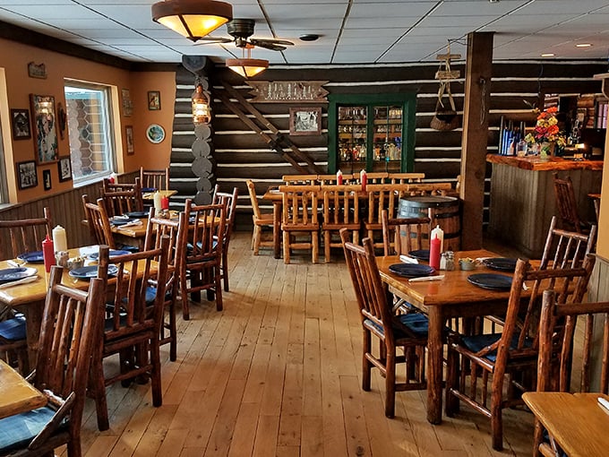 Log walls and wooden beams create the perfect backdrop for memorable meals, like dining in a luxury cabin someone else has to clean.