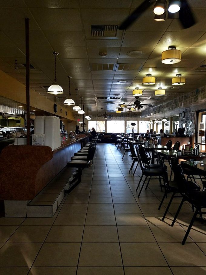 Classic diner ambiance with counter seating that whispers, "Stay awhile." The ceiling fans lazily turn as if they too are in a post-breakfast stupor.