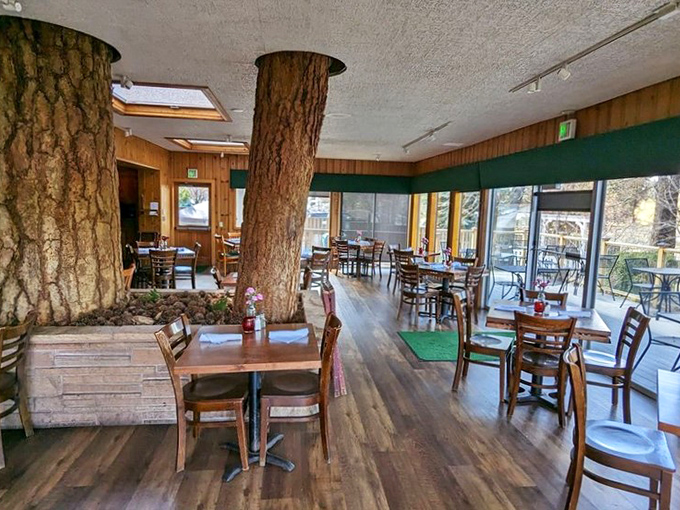Those aren't decorative features&mdash;actual pine trees grow through the floor and ceiling, creating Oregon's most unique dining backdrop.