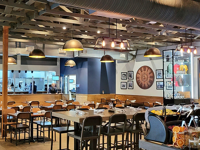 Industrial-chic meets barbecue comfort in Q39's dining room. The pendant lights cast a golden glow that makes every plate look like a magazine cover.