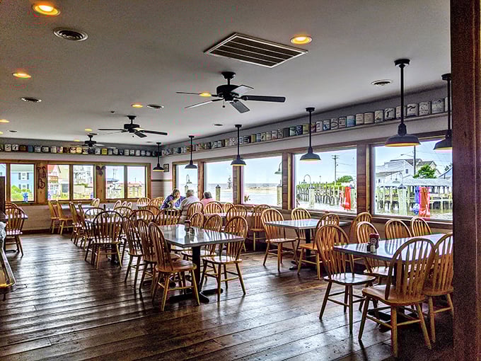 Wide windows flood the dining room with natural light, offering views that make you question why anyone would ever build a restaurant anywhere but on the water.
