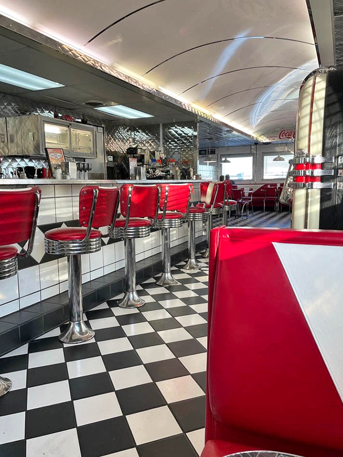 Red vinyl, chrome accents, and checkered floors: This is what breakfast nostalgia looks like in three dimensions.