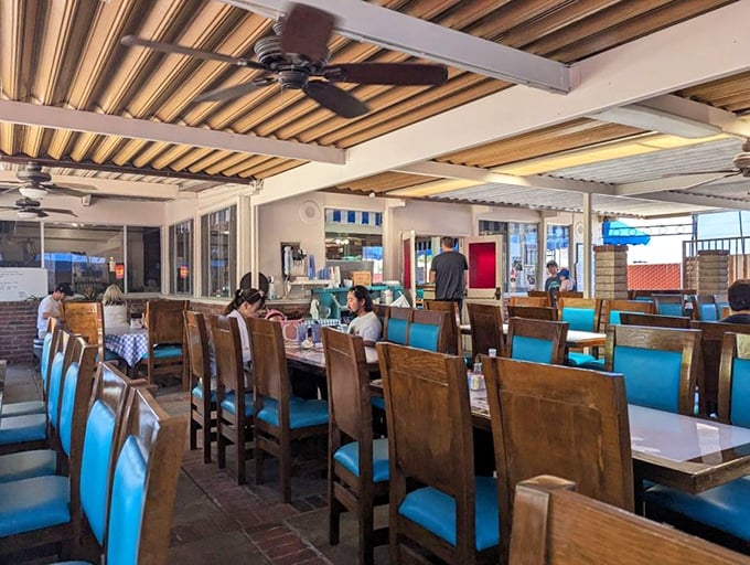 Wooden tables and turquoise chairs create that perfect "I've found my new favorite spot" feeling that every great diner should deliver.