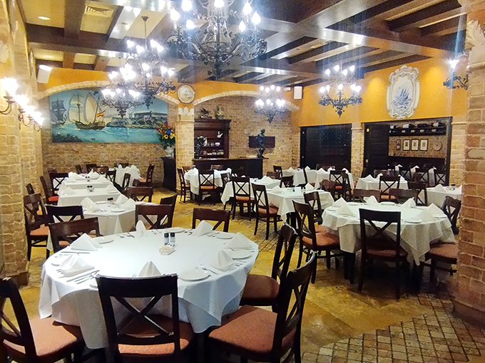 Elegant chandeliers cast a warm glow over pristine white tablecloths. This isn't just dinner&mdash;it's a century-old tradition of hospitality in every detail.
