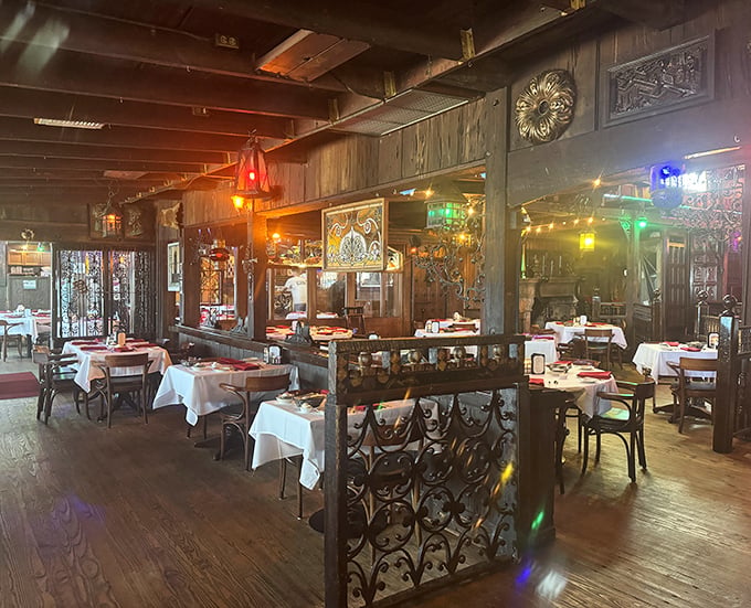 Step inside to a maritime wonderland where wood paneling, ornate dividers, and twinkling lights create the perfect backdrop for memorable meals.