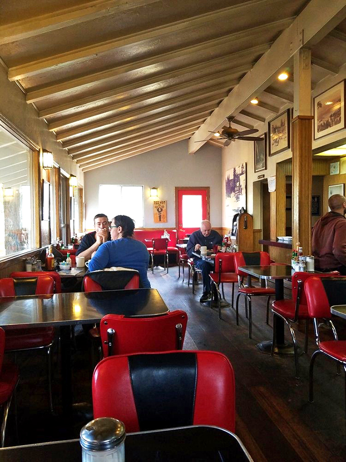 The interior showcases classic diner charm with exposed beams and historical photos, creating that perfect "I've found a hidden gem" feeling we all secretly crave.