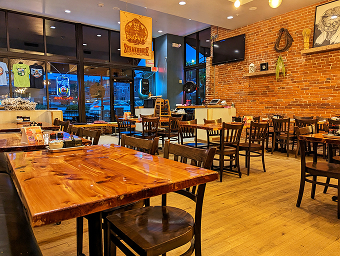 Wooden tables, exposed brick walls, and warm lighting create that perfect "come sit a spell" atmosphere that makes breakfast feel like a vacation.