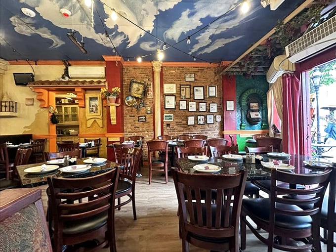 Step inside and the ceiling's painted sky tells you everything: this isn't just dinner, it's an escape. Exposed brick walls hold memories of countless "that was amazing" moments.