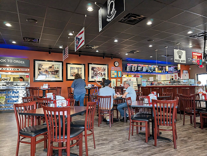 Inside, the warm orange walls and wooden chairs create that perfect "come as you are" atmosphere where comfort trumps pretension every time. 