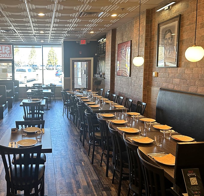 Simple wooden tables, exposed brick walls, and globe lighting create that rare atmosphere where you feel instantly at home, yet somehow special.