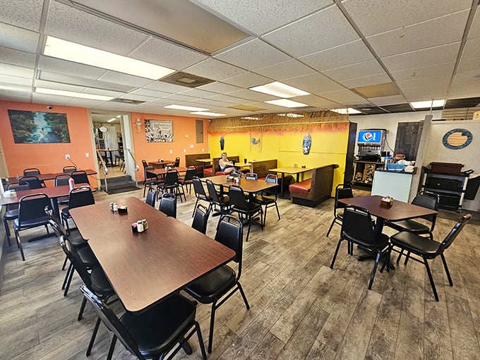 Simple wooden tables and colorful walls create that perfect "everybody knows your name" atmosphere where breakfast dreams come true and coffee cups never empty.