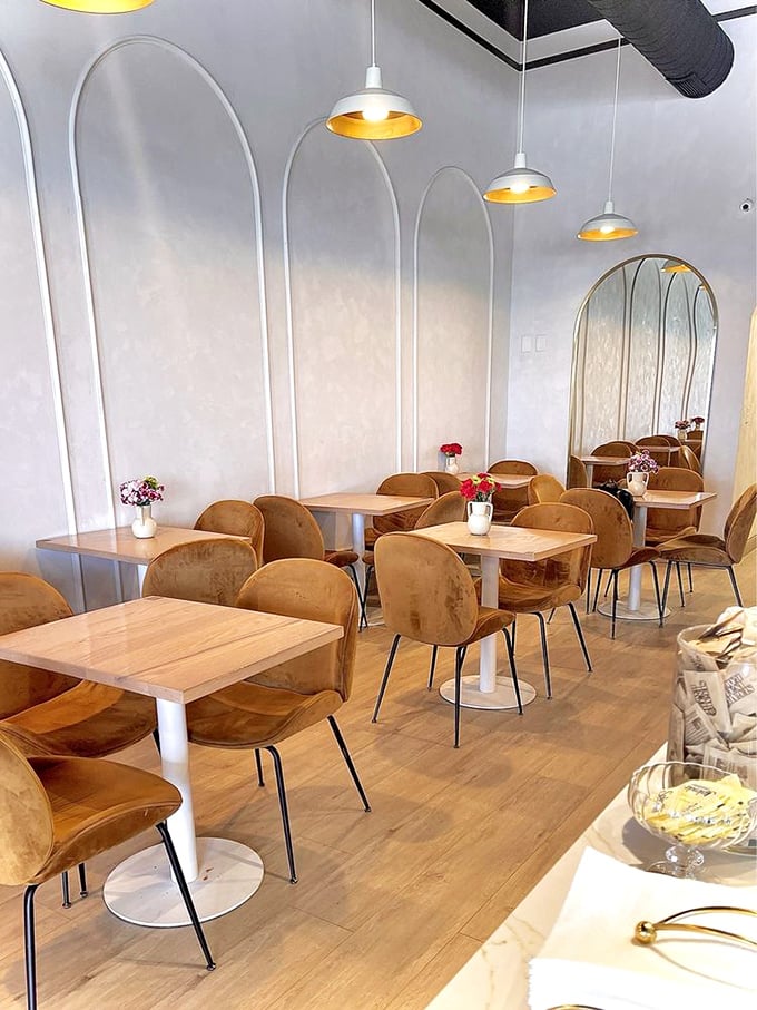 A modern sanctuary where golden-hued pendant lights cast the kind of glow that makes everyone look like they're starring in their own food documentary.