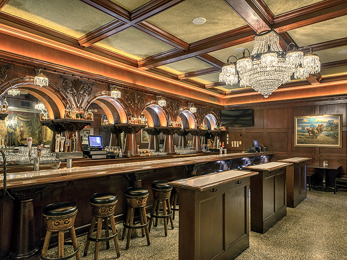 Crystal chandeliers and rich wood paneling create a bar that would make John Wayne feel at home. Old Hollywood meets cattle country in this elegant watering hole.
