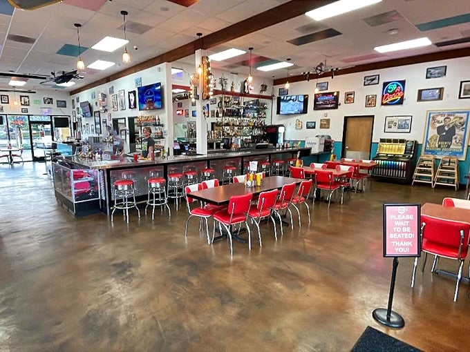 Classic red vinyl stools, chrome accents, and walls adorned with memorabilia&mdash;this isn't decoration, it's a time machine disguised as a diner.