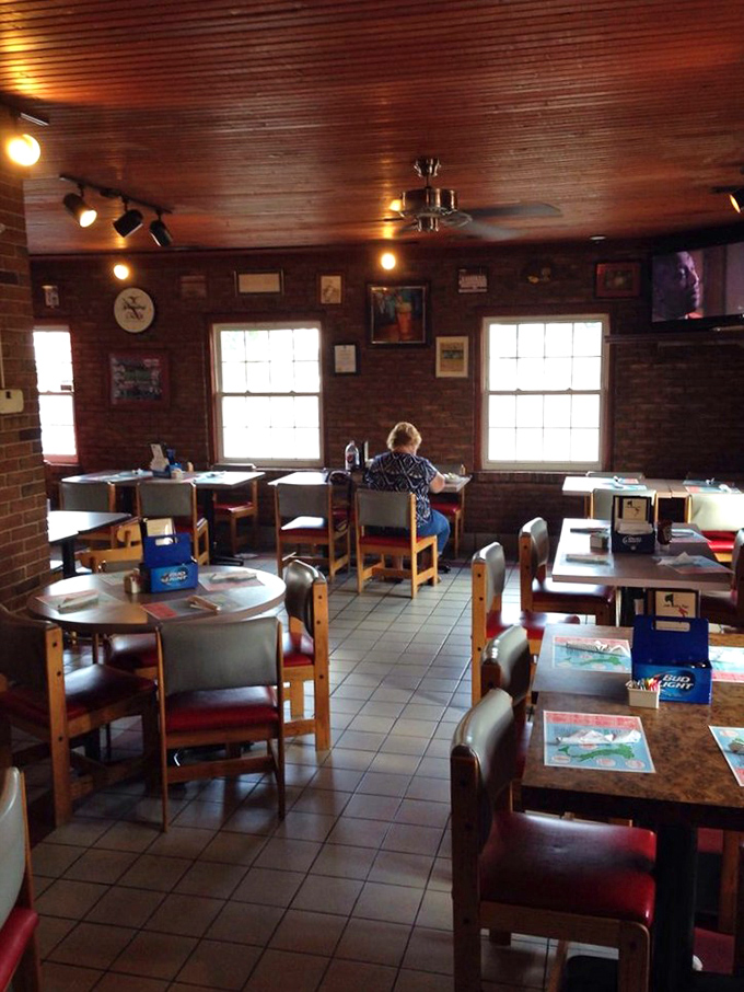 Classic pizzeria ambiance with wood-paneled walls and no-nonsense seating. This isn't Instagram-bait decor&mdash;it's the real deal where the food, not the furniture, takes center stage.