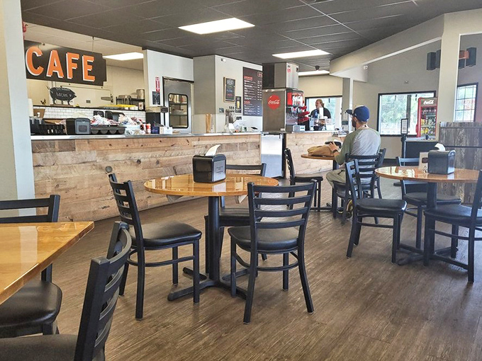 Inside, rustic meets functional with wooden tables and a reclaimed barnwood counter. This isn't a place for Instagram posing—it's for serious eating.