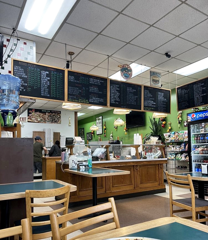 Villa Roma's updated exterior maintains that neighborhood pizzeria charm, where the "PIZZA" sign glows like a beacon for the hungry and hopeful.