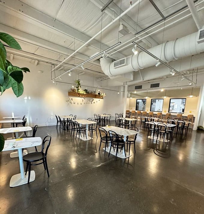 Industrial-chic meets Parisian caf&eacute; vibes in this airy space where marble tables and bentwood chairs invite you to linger over coffee.