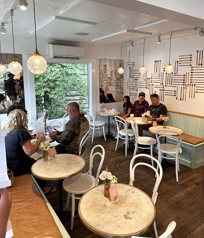 Where Parisian caf&eacute; meets Wyoming charm. The geometric wood wall art and globe pendant lights create an atmosphere that says, "Stay awhile, your diet can wait until tomorrow."