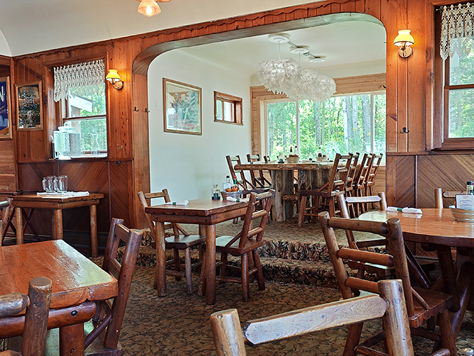 Knotty pine walls embrace diners like a warm flannel shirt, while rustic log furniture whispers tales of countless satisfied meals shared among friends.