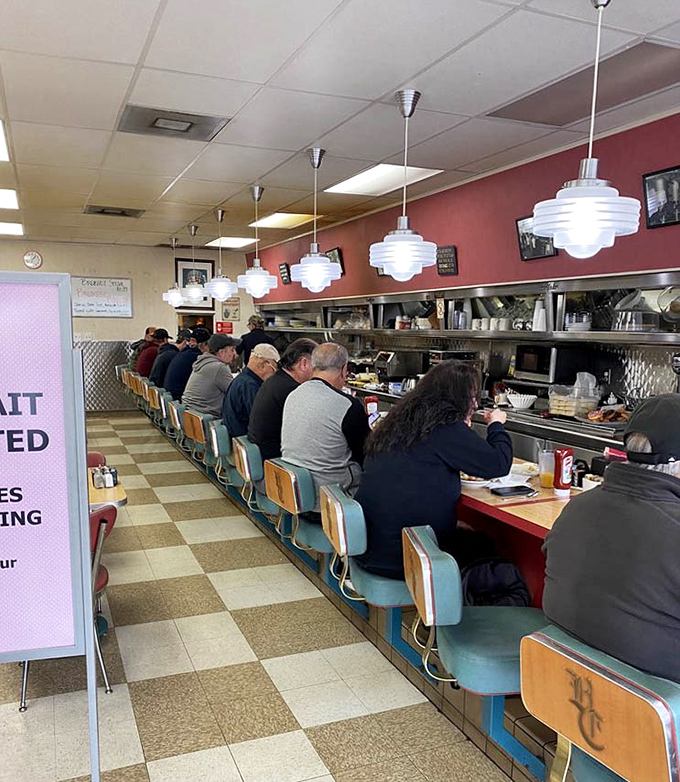 Counter culture at its finest! The classic diner setup invites you to perch on a turquoise stool and watch breakfast magic unfold before your eyes.