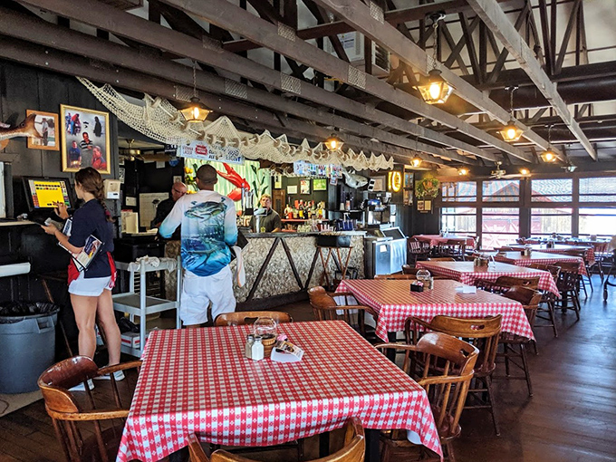 Red and white checkered tablecloths aren't just decoration&mdash;they're a promise that serious seafood feasting is about to happen. Note the fishing nets overhead!