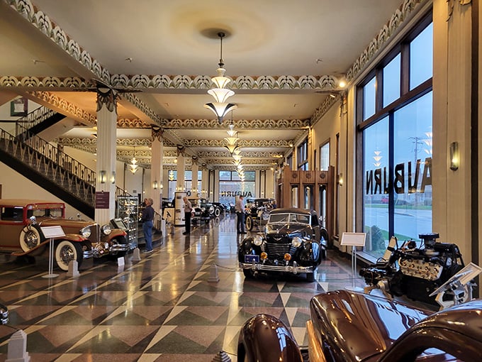 Step inside and suddenly you're Gatsby-rich in the Roaring Twenties. That checkerboard floor has seen more automotive legends than most people see in a lifetime.