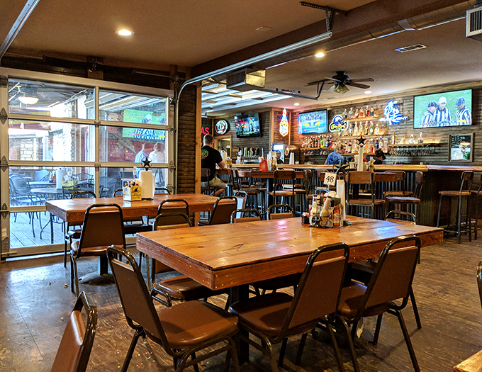 Inside Johnny's, wooden tables and neon beer signs create that perfect "come as you are" atmosphere where memorable meals and conversations unfold.