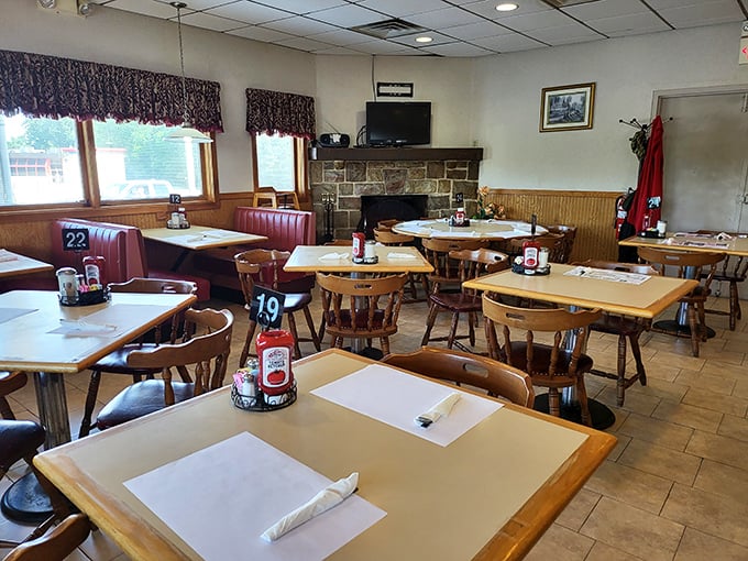 Classic diner comfort awaits inside with wooden tables, red booth seating, and a stone fireplace that promises warmth on chilly Pennsylvania mornings.